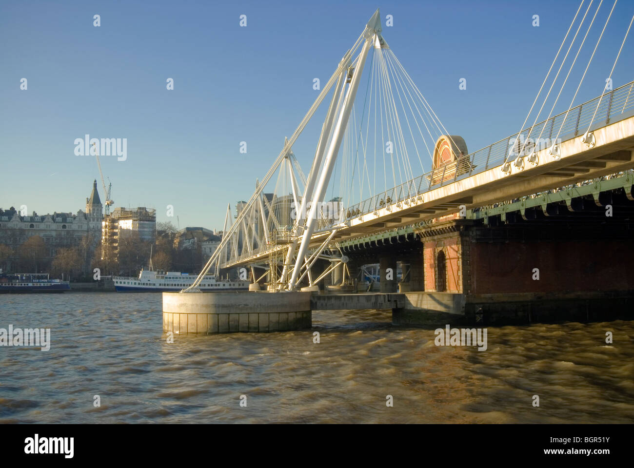 Hungerford Bridge on the River Thames at Charing Cross and the west ...