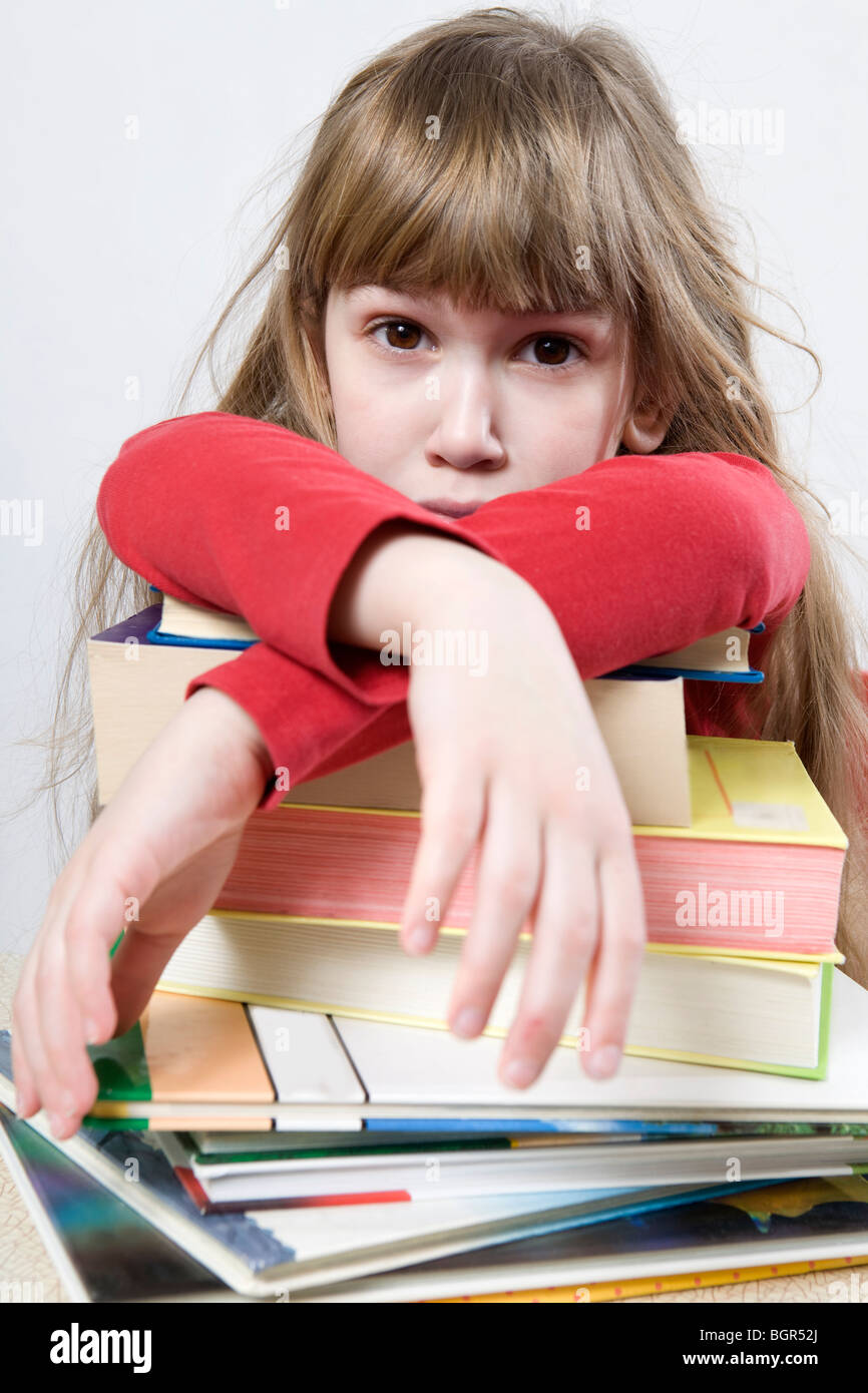 Is it possible to read all these books? little cute sad girl with a ...