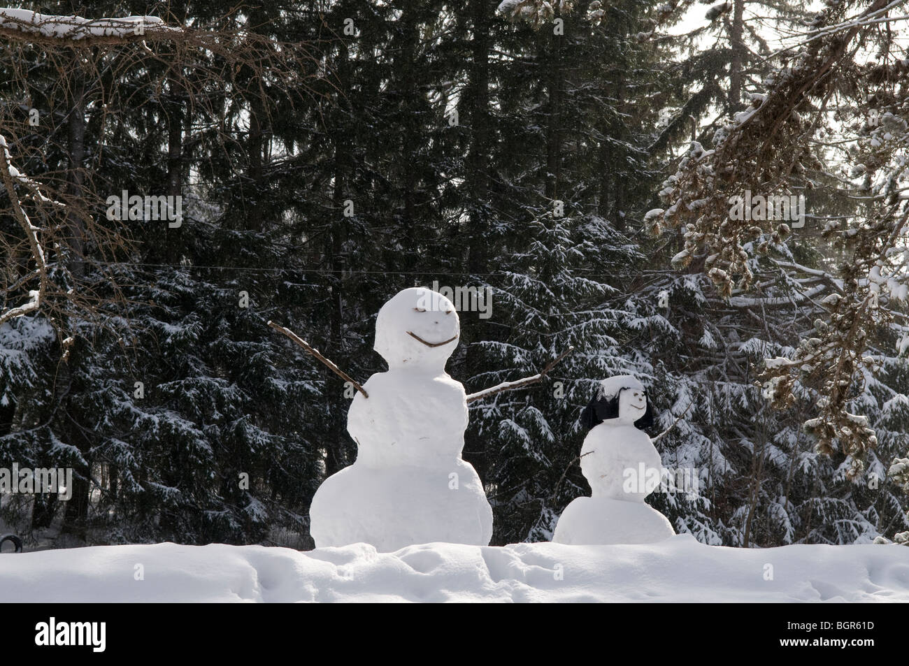 Two people with snowmen hi-res stock photography and images - Alamy