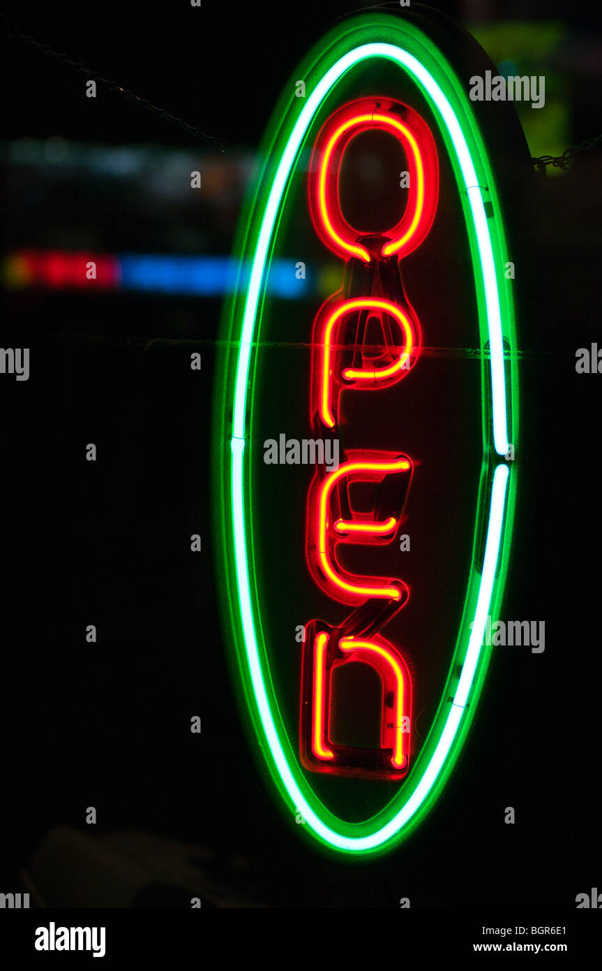 Neon "open" sign in a store window Stock Photo - Alamy