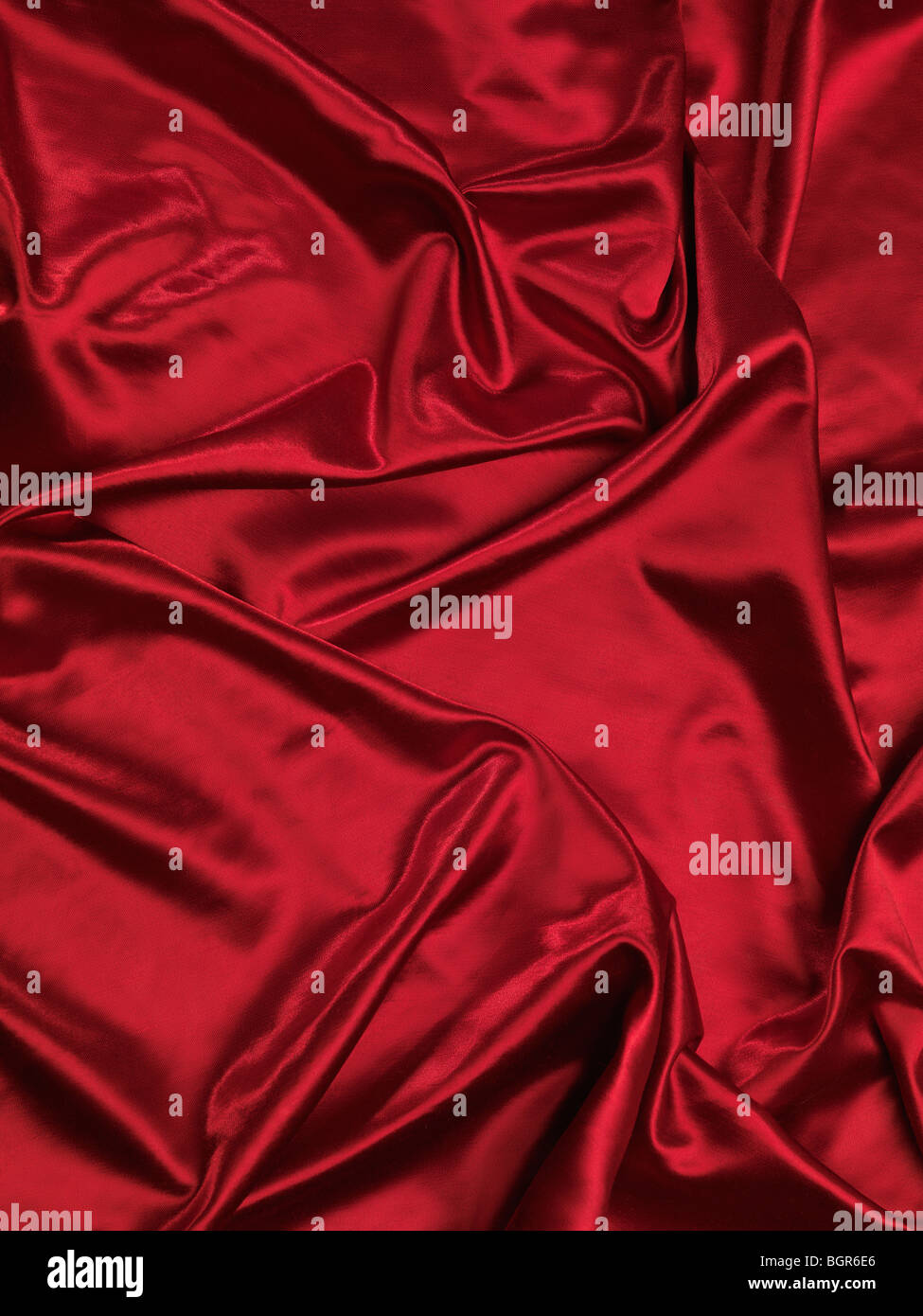 Red shiny silky fabric background Stock Photo - Alamy