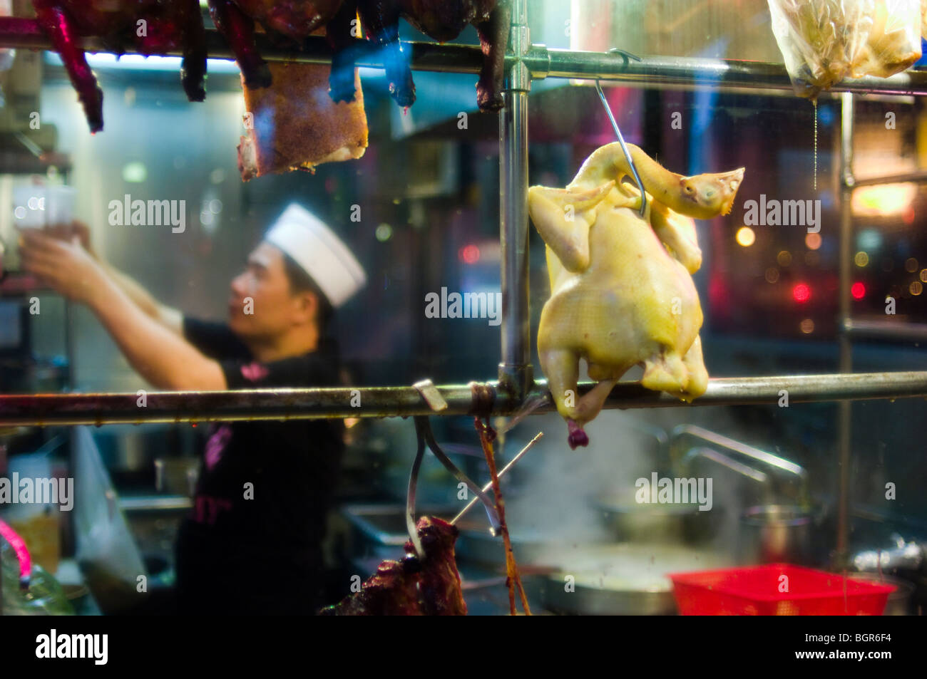 A duck hanging in the window of a Chinatown restaurant kitchen. New ...