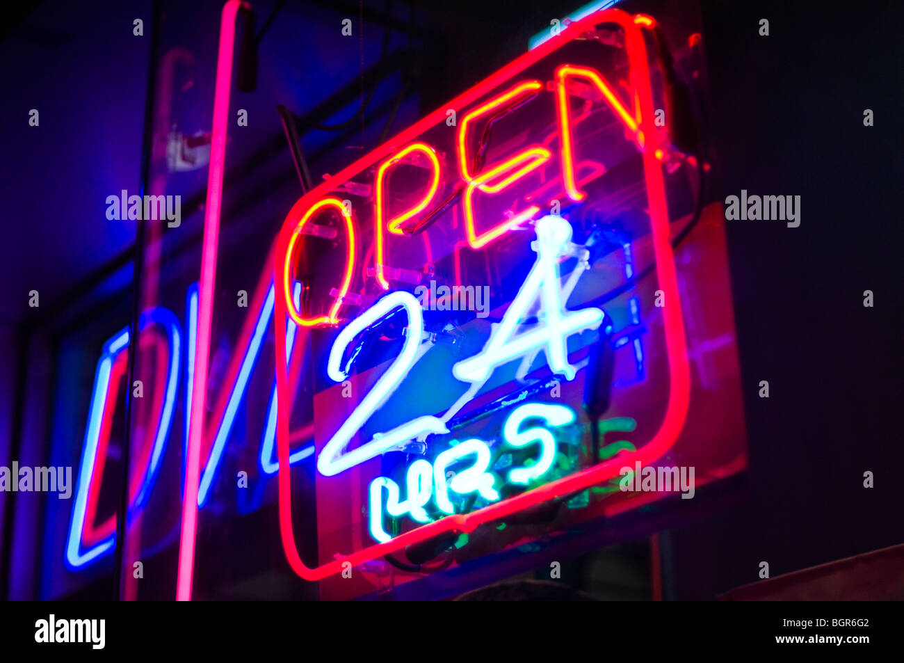 Neon "open 24 hours" sign Stock Photo - Alamy