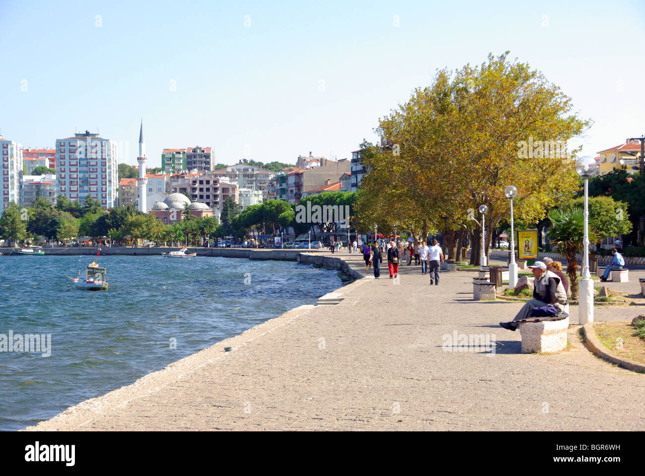 Canakkale Turkish seaport town people walking on Dardanelles waterfront ...
