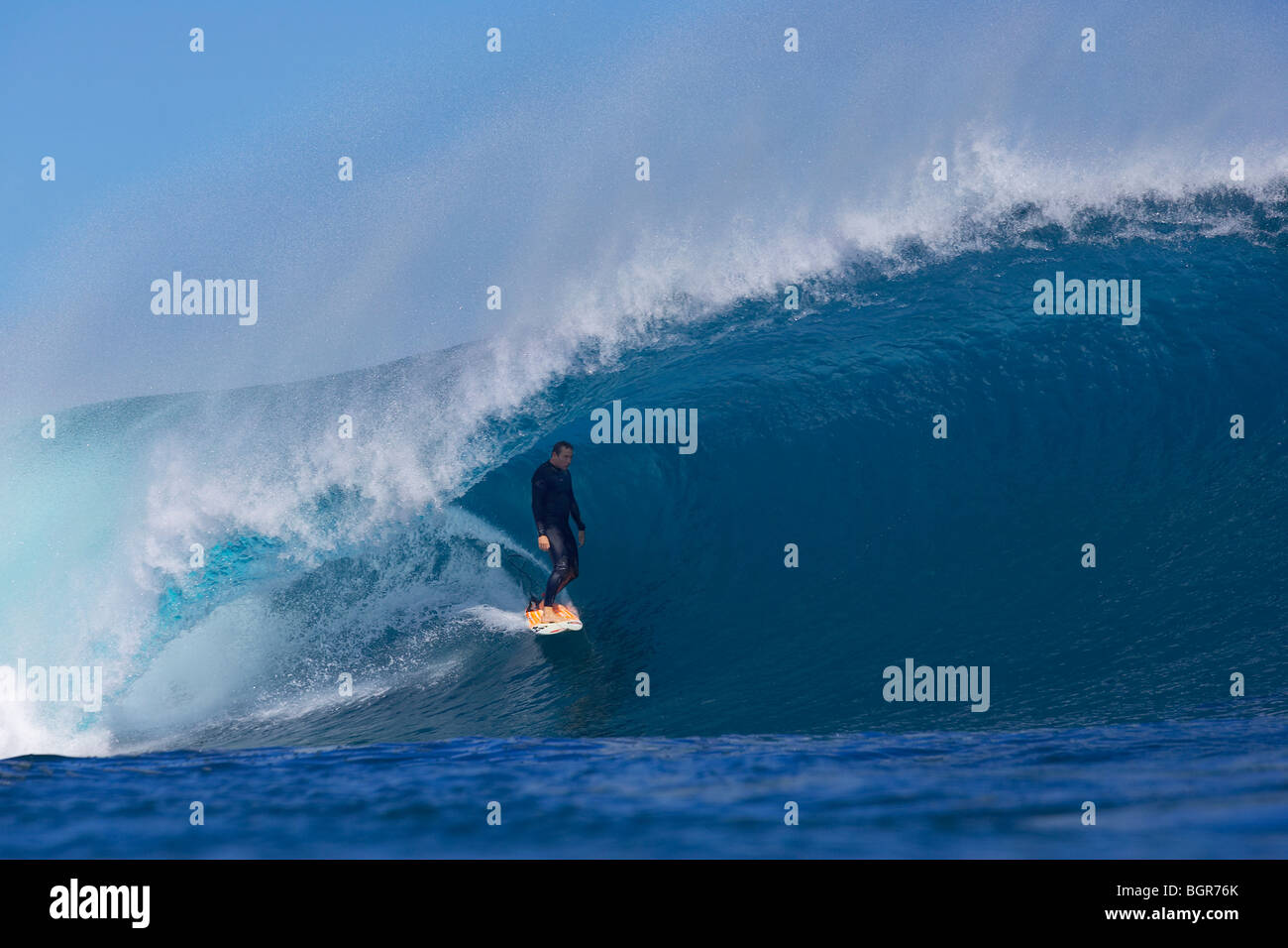 Surfer on a wave Stock Photo - Alamy