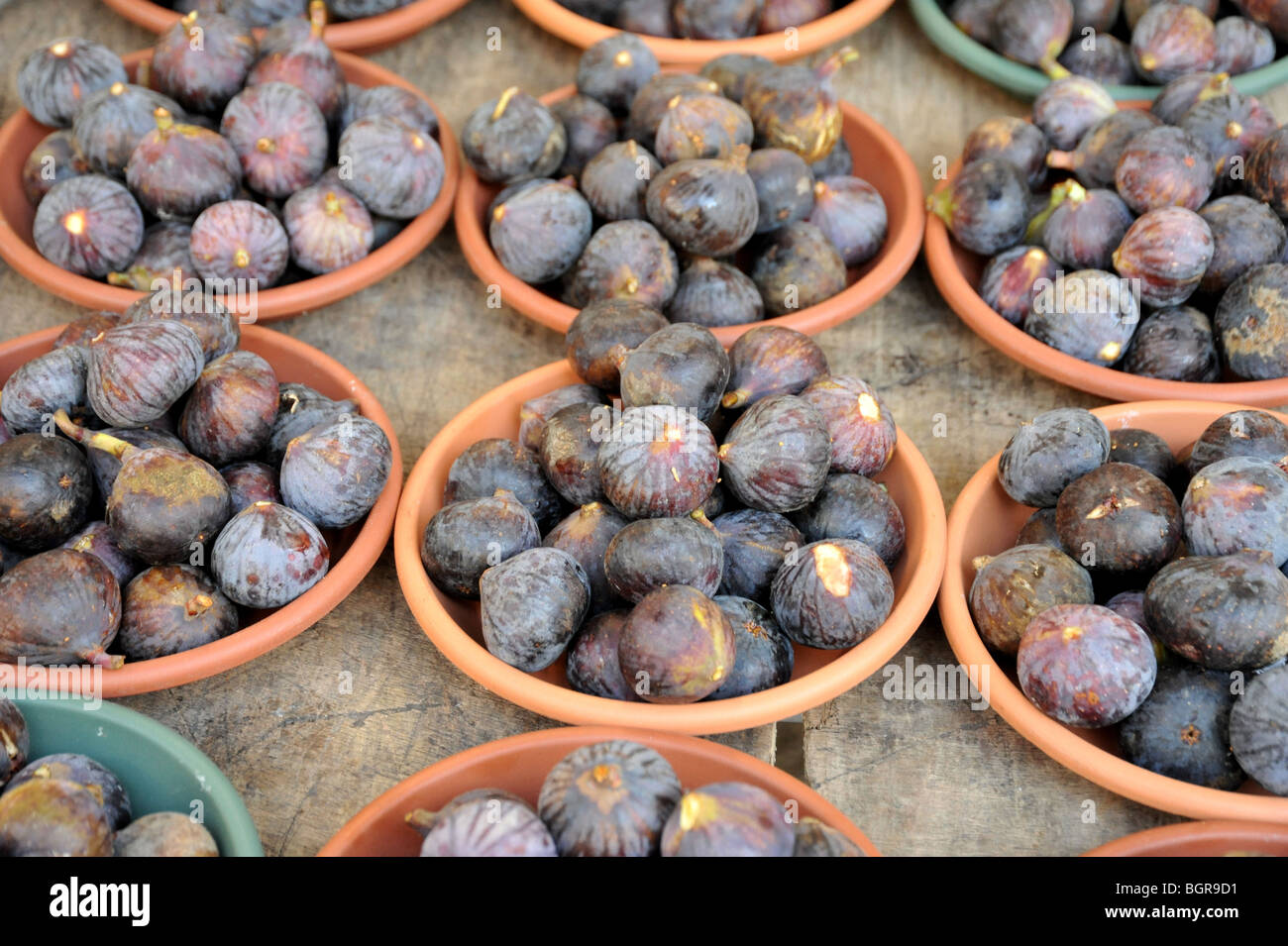 Bowls of fresh black figs for sale at a French street market Stock ...