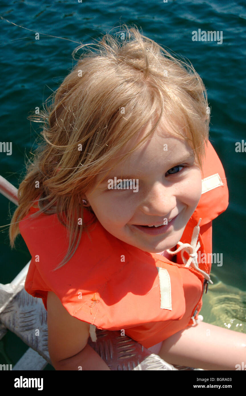 A girl wearing a life jacket Stock Photo - Alamy