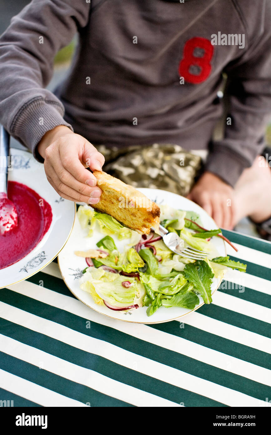 A boy eating dinner Stock Photo - Alamy
