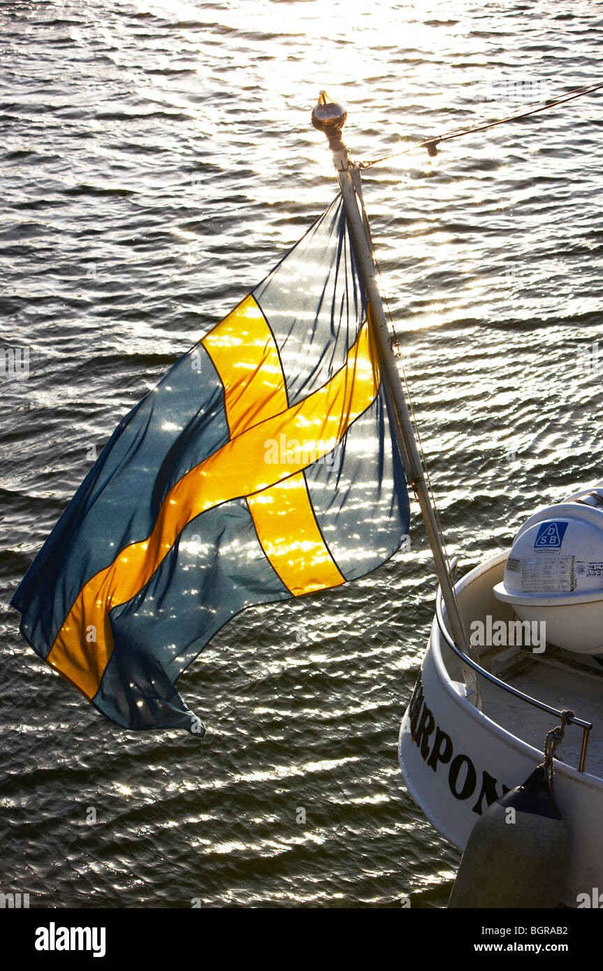 The Swedish flag on a boat, Sweden Stock Photo - Alamy