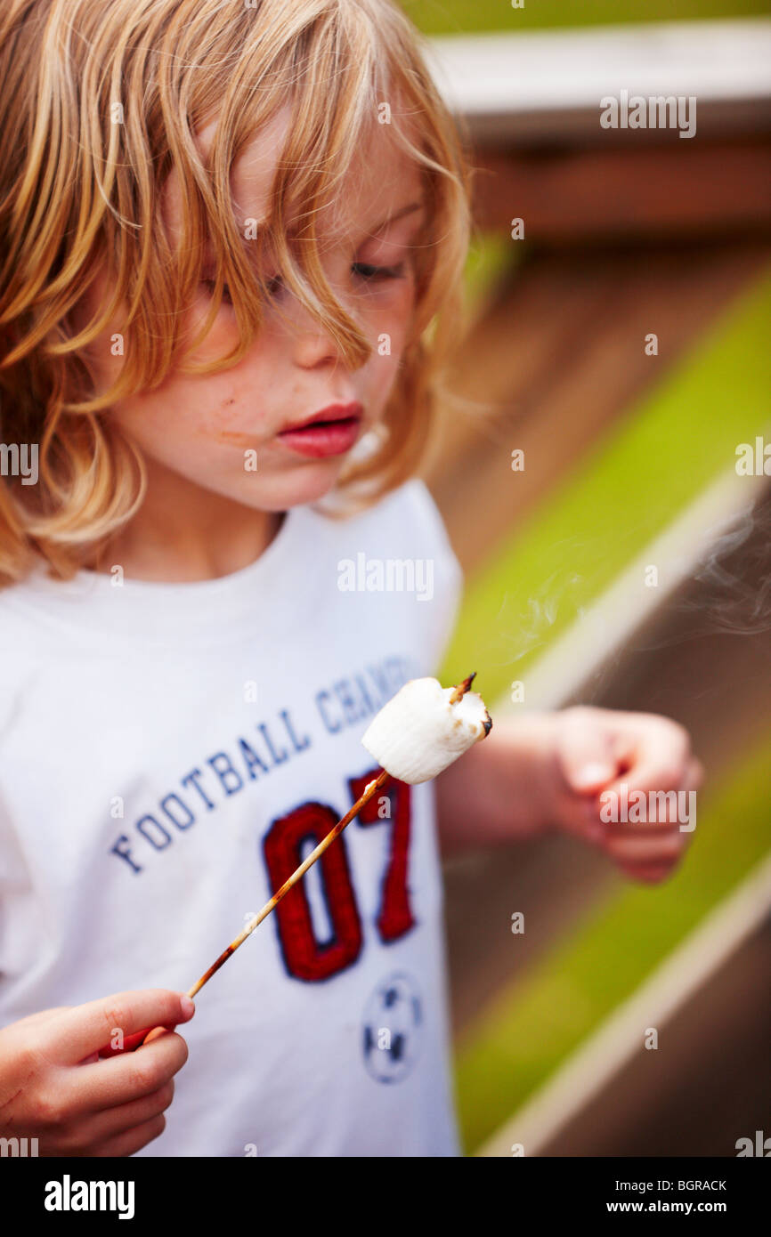 A boy eating marshmallow, Sweden Stock Photo - Alamy