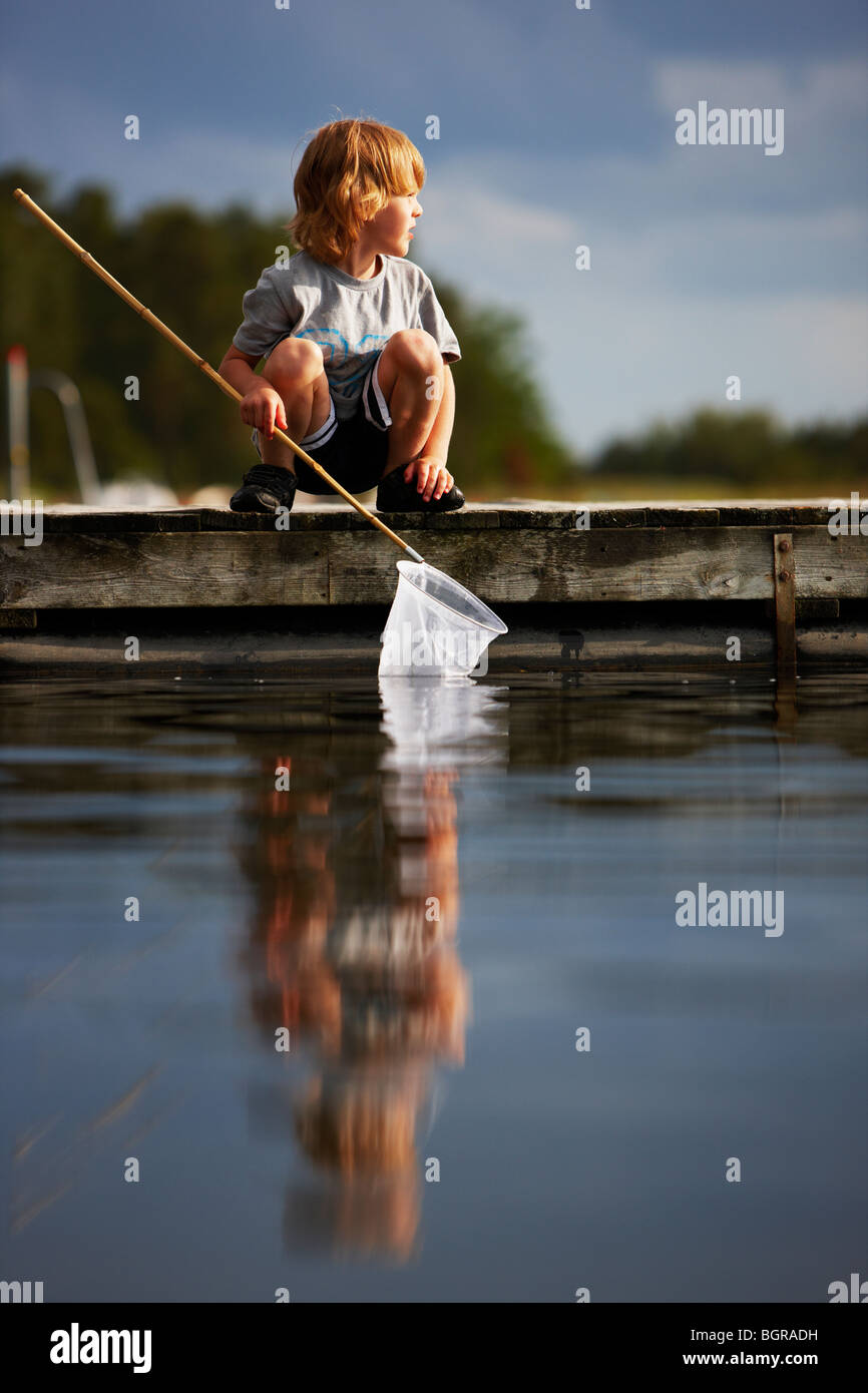 A boy fishing, Sweden Stock Photo - Alamy