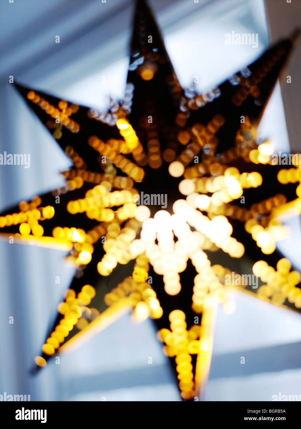 A star-shaped lantern hung in windows during Advent and Christmas Stock ...
