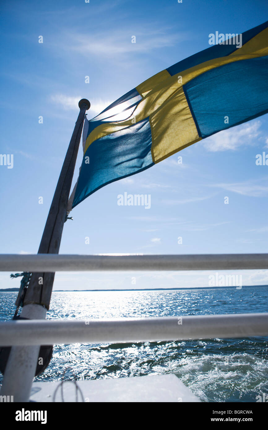 The Swedish flag on a boat, Sweden Stock Photo - Alamy