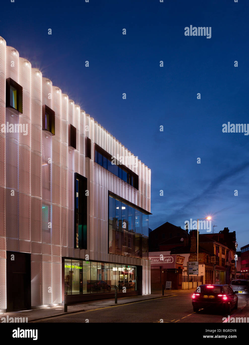 the quarterhouse folkestone alison brooks architects dusk with lights ...