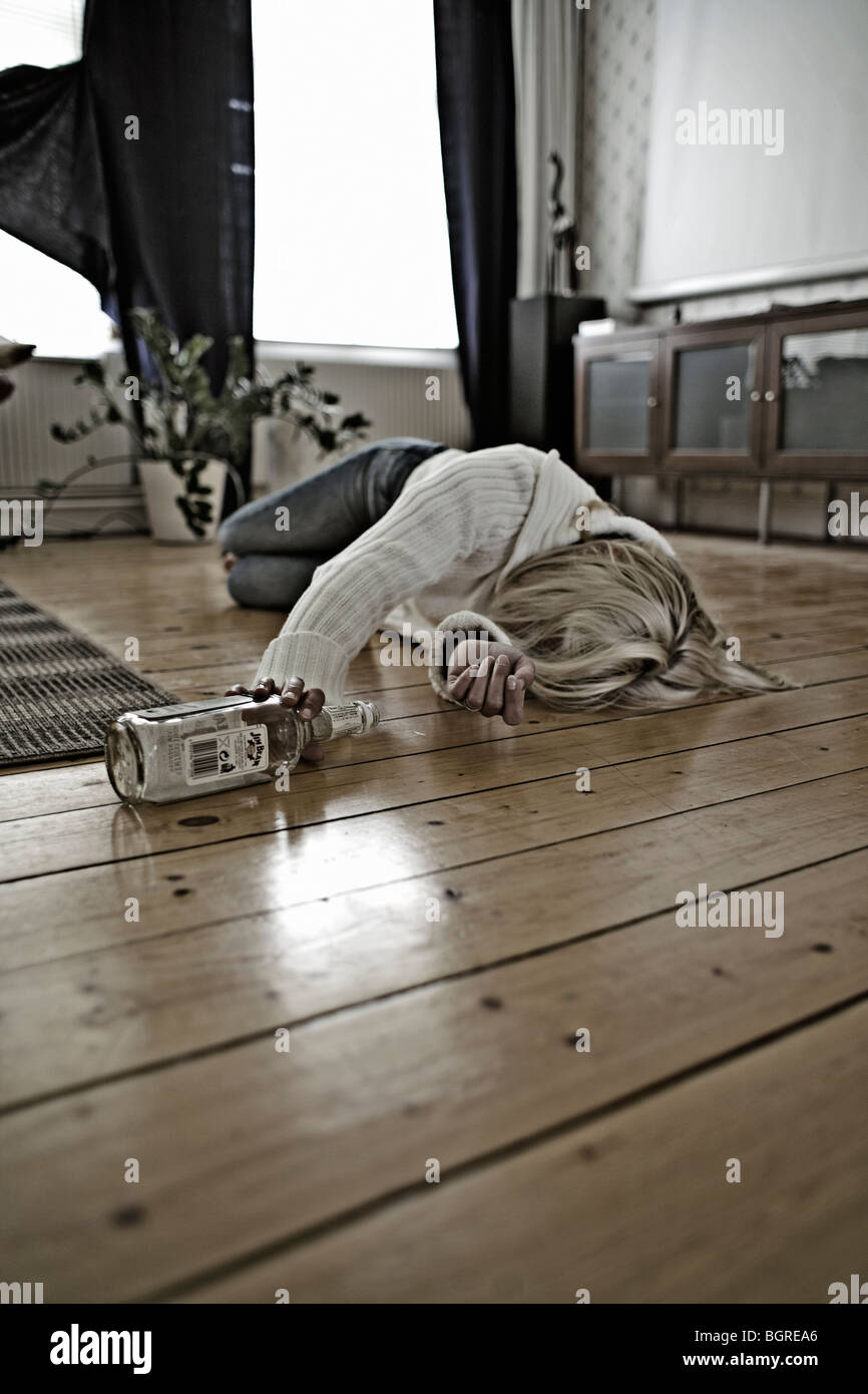 A drunken woman lying on the floor, Sweden Stock Photo - Alamy