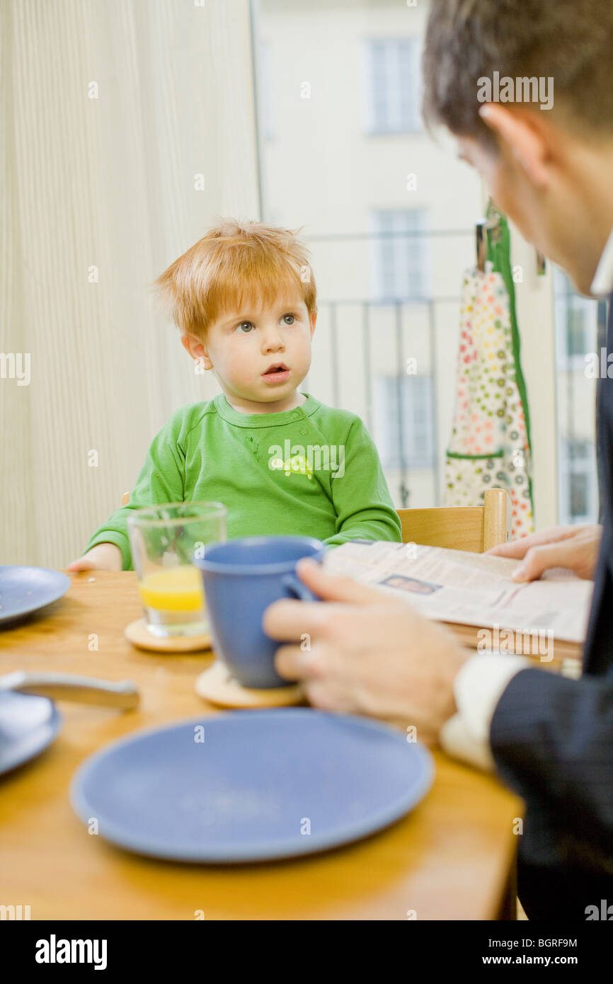 Boy eating breakfast newspaper hi-res stock photography and images - Alamy