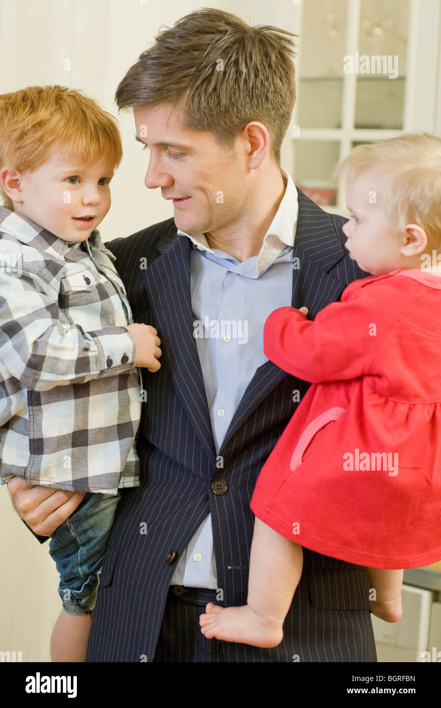 Father with two small children, Sweden Stock Photo - Alamy