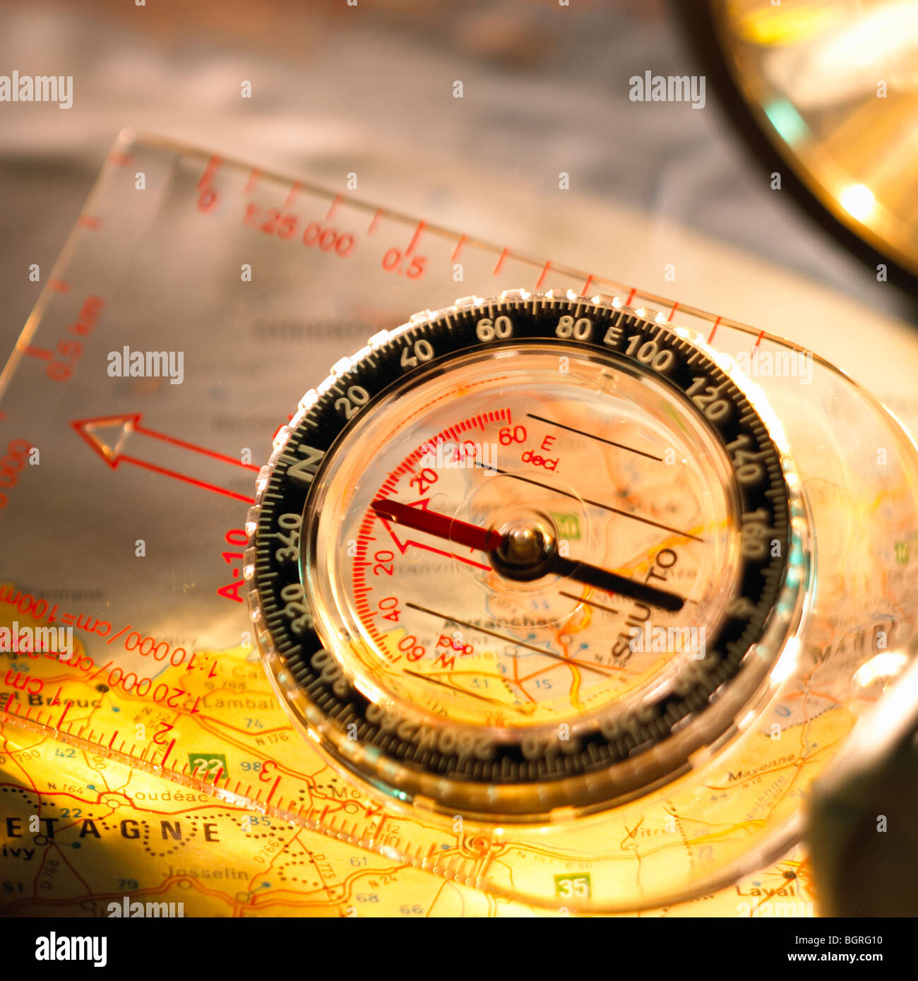 Compass in front of a map Stock Photo - Alamy