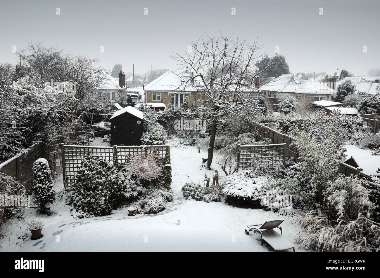 Suburban garden covered in snow Stock Photo - Alamy