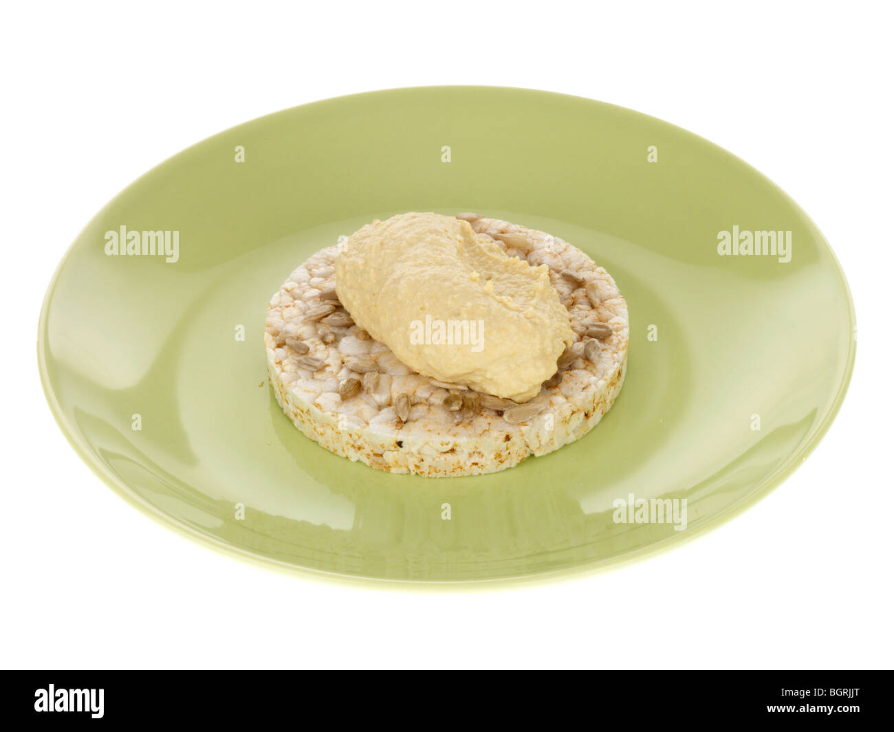 Pumpkin Seed Rice Cake with Hummus Stock Photo - Alamy