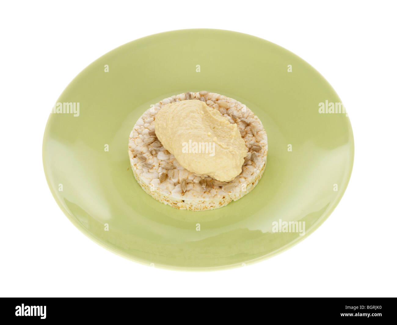 Pumpkin Seed Rice Cake with Hummus Stock Photo - Alamy