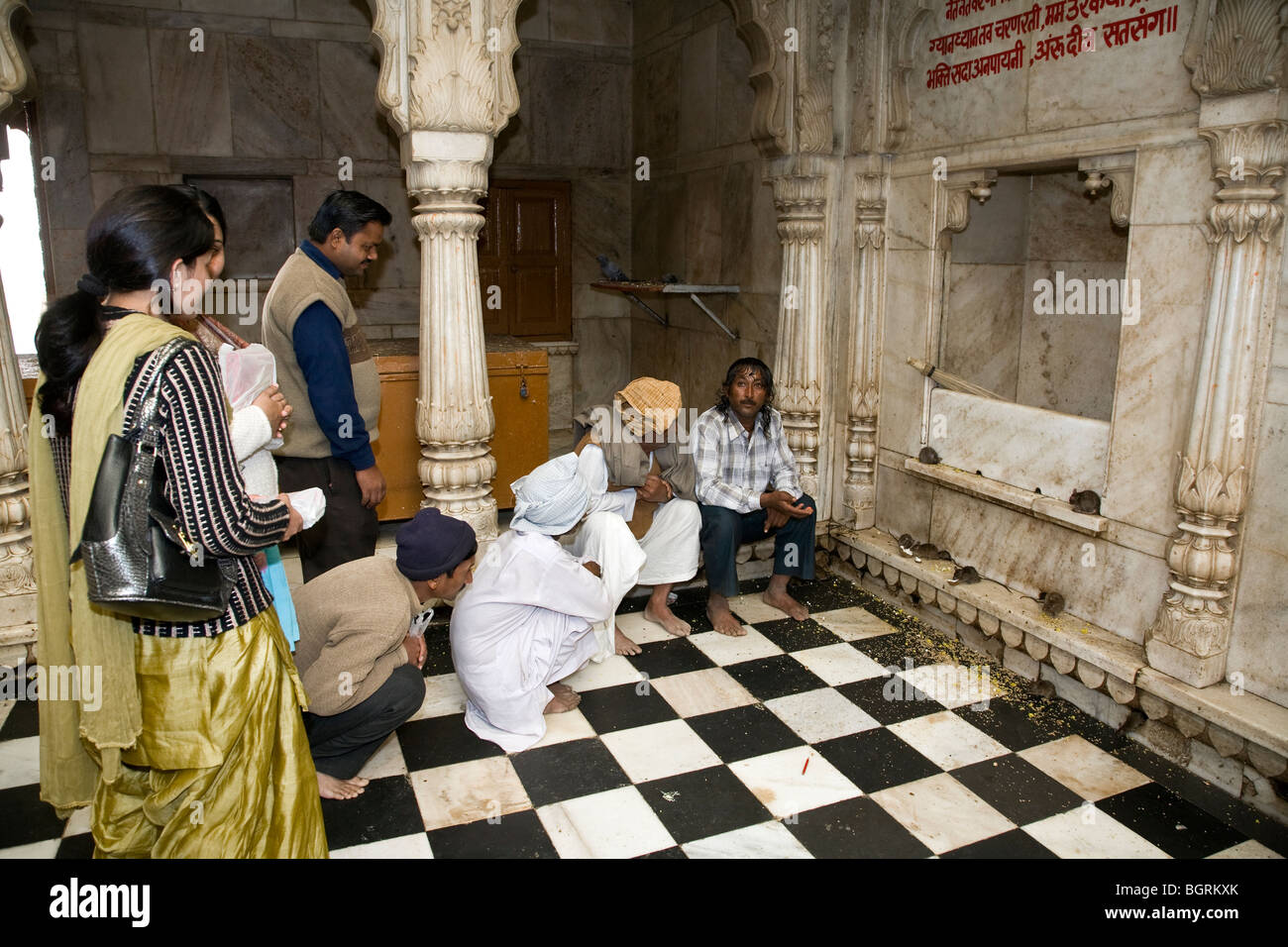 Indian pilgrims worshiping the rats. Karni Mata Temple. Deshnok. Near ...