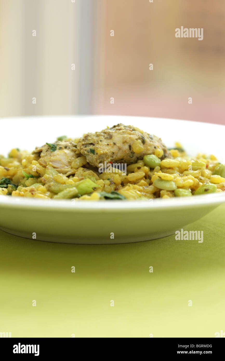 Yellow Thai Risotto with Spiced Chicken Stock Photo - Alamy