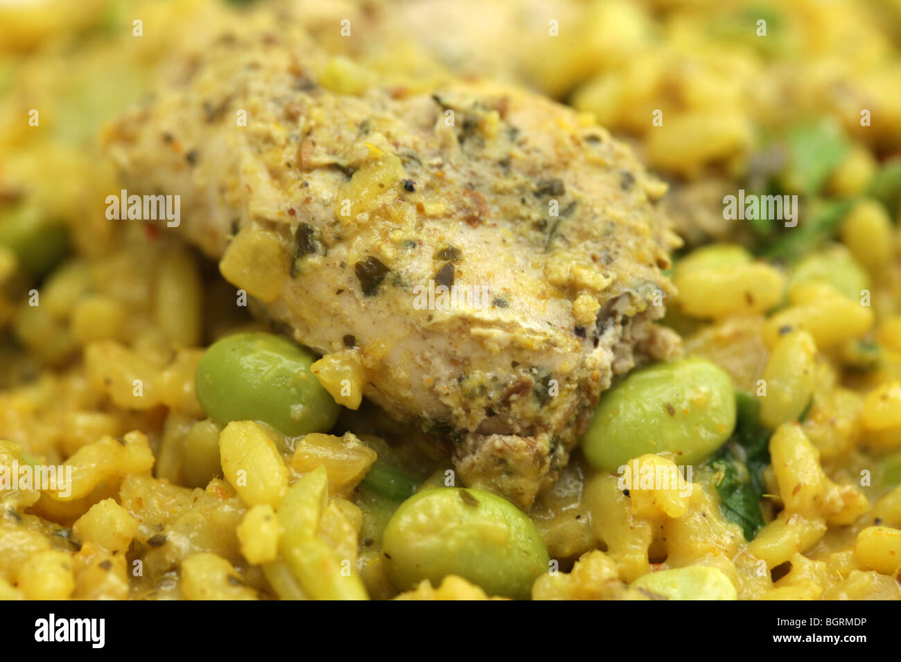 Yellow Thai Risotto with Spiced Chicken Stock Photo - Alamy