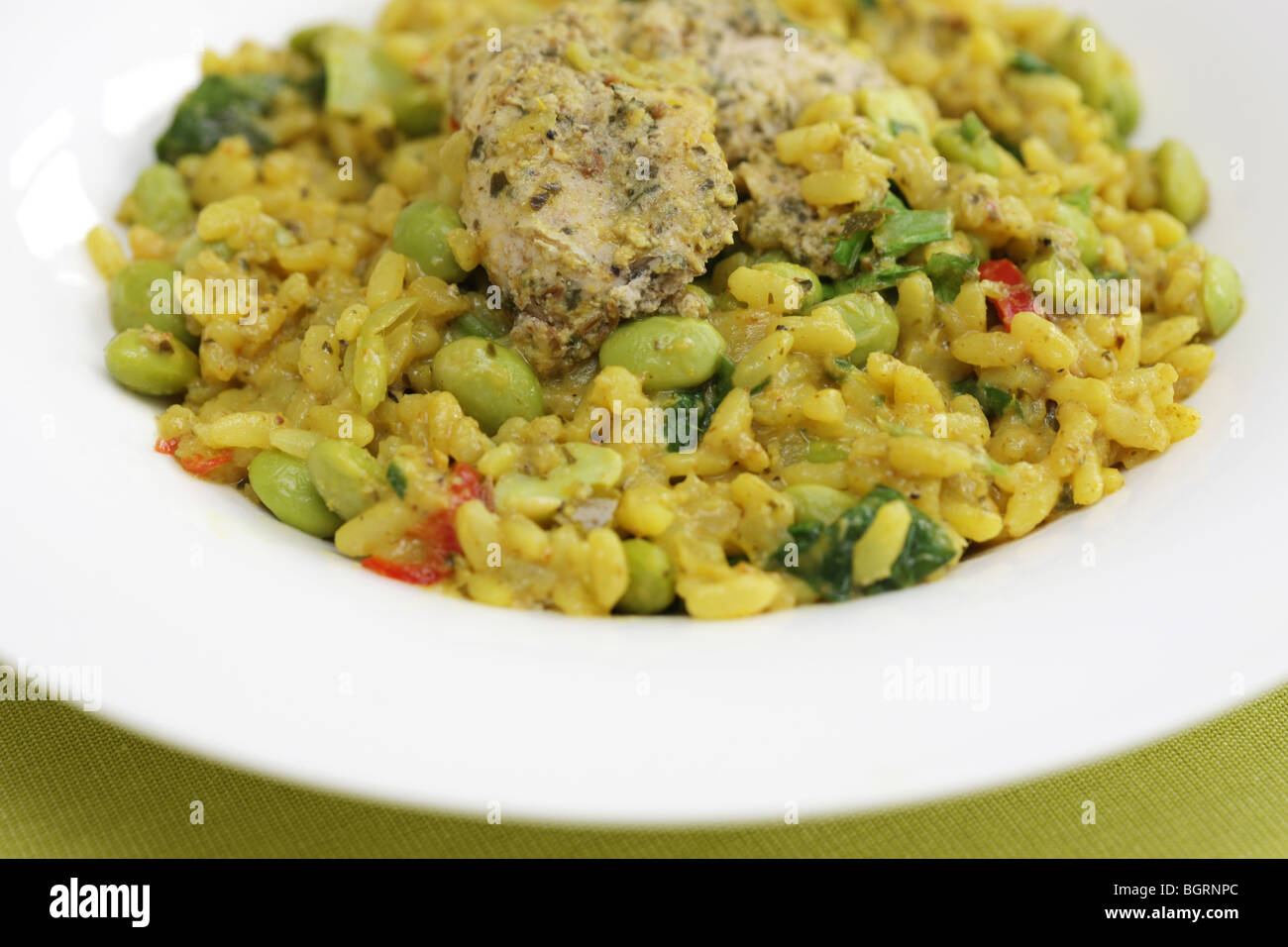 Yellow Thai Risotto with Spiced Chicken Stock Photo - Alamy