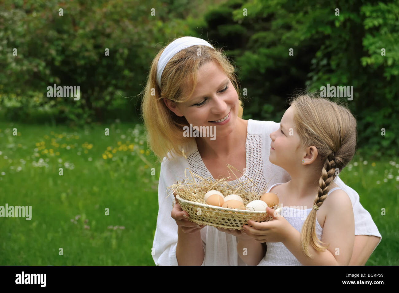 Young mother and daughter having Easter time Stock Photo - Alamy