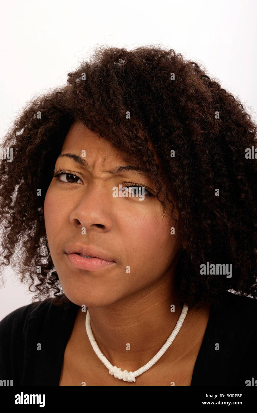 Thoughtful looking young woman Stock Photo - Alamy