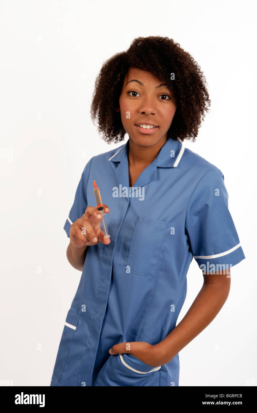 young nurse holding a syringe ready for an injection Stock Photo - Alamy