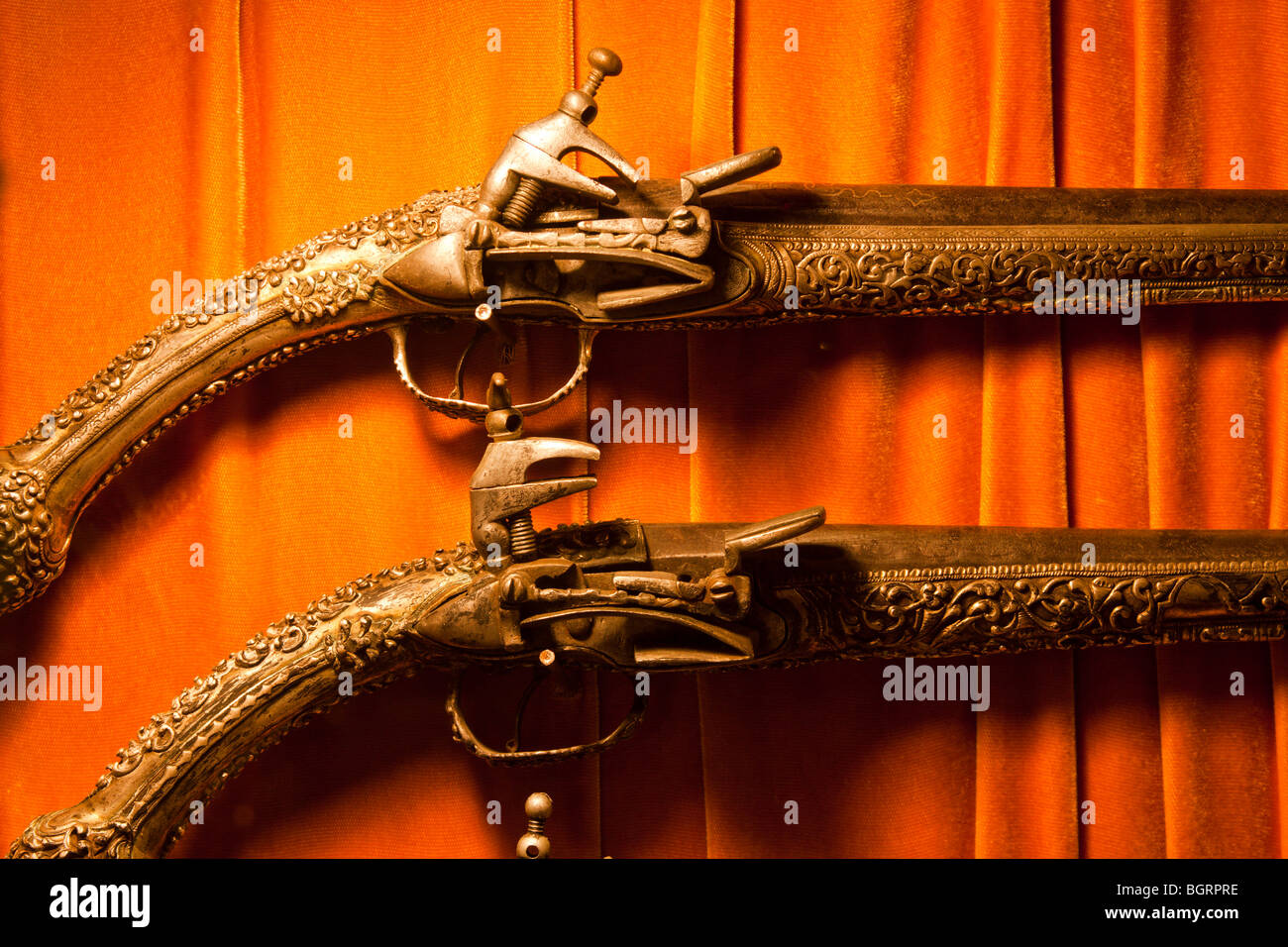 Vintage Guns on a Red Backdrop Stock Photo - Alamy