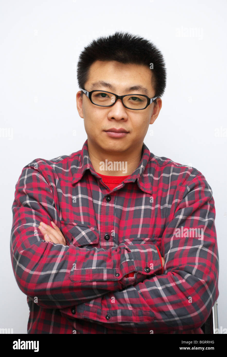arm crossed young man Stock Photo - Alamy