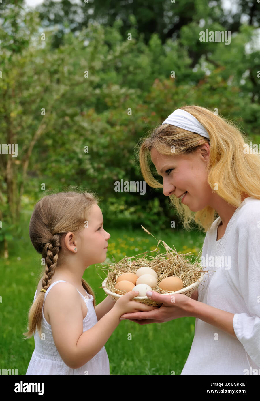 Young mother and daughter having Easter time Stock Photo - Alamy