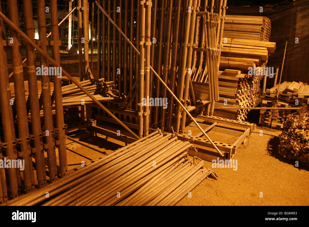 scaffolding assembly pieces in building site at night Stock Photo - Alamy