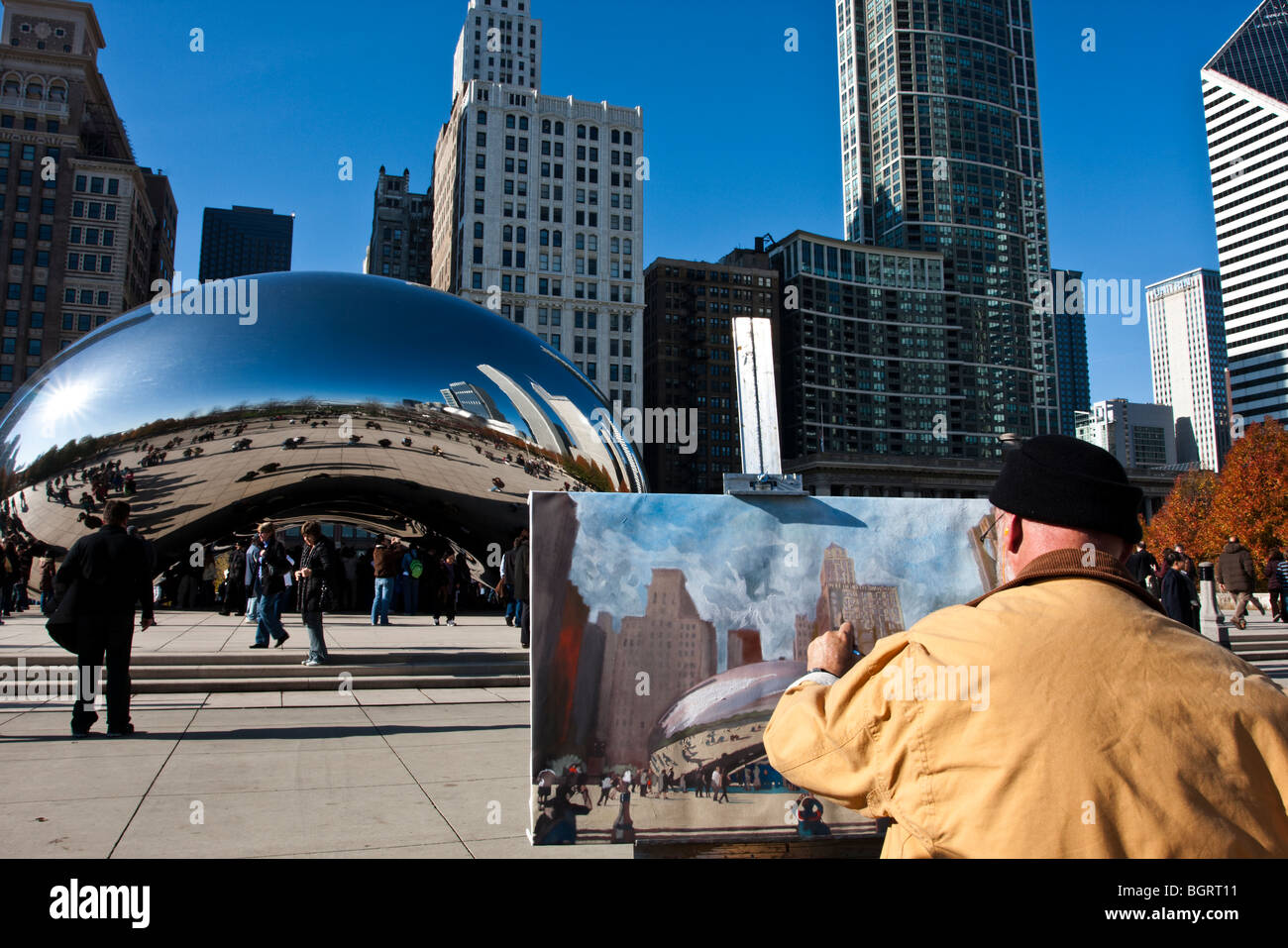 Artist Painting Cloud Gate sculpture in Millennium Park, Chicago Stock ...