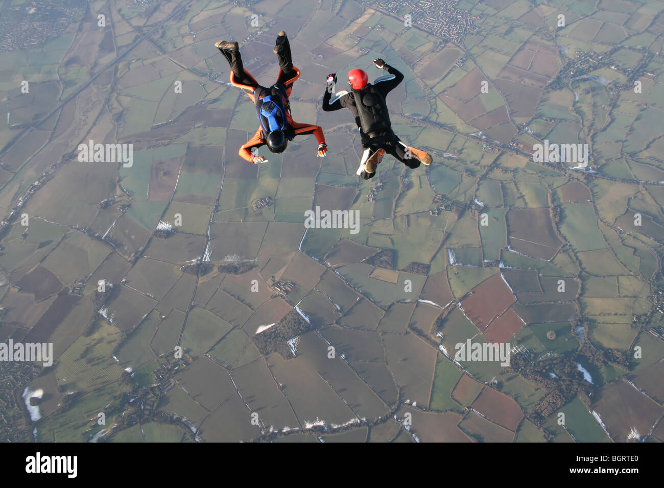 Two skydivers in free fall Stock Photo - Alamy