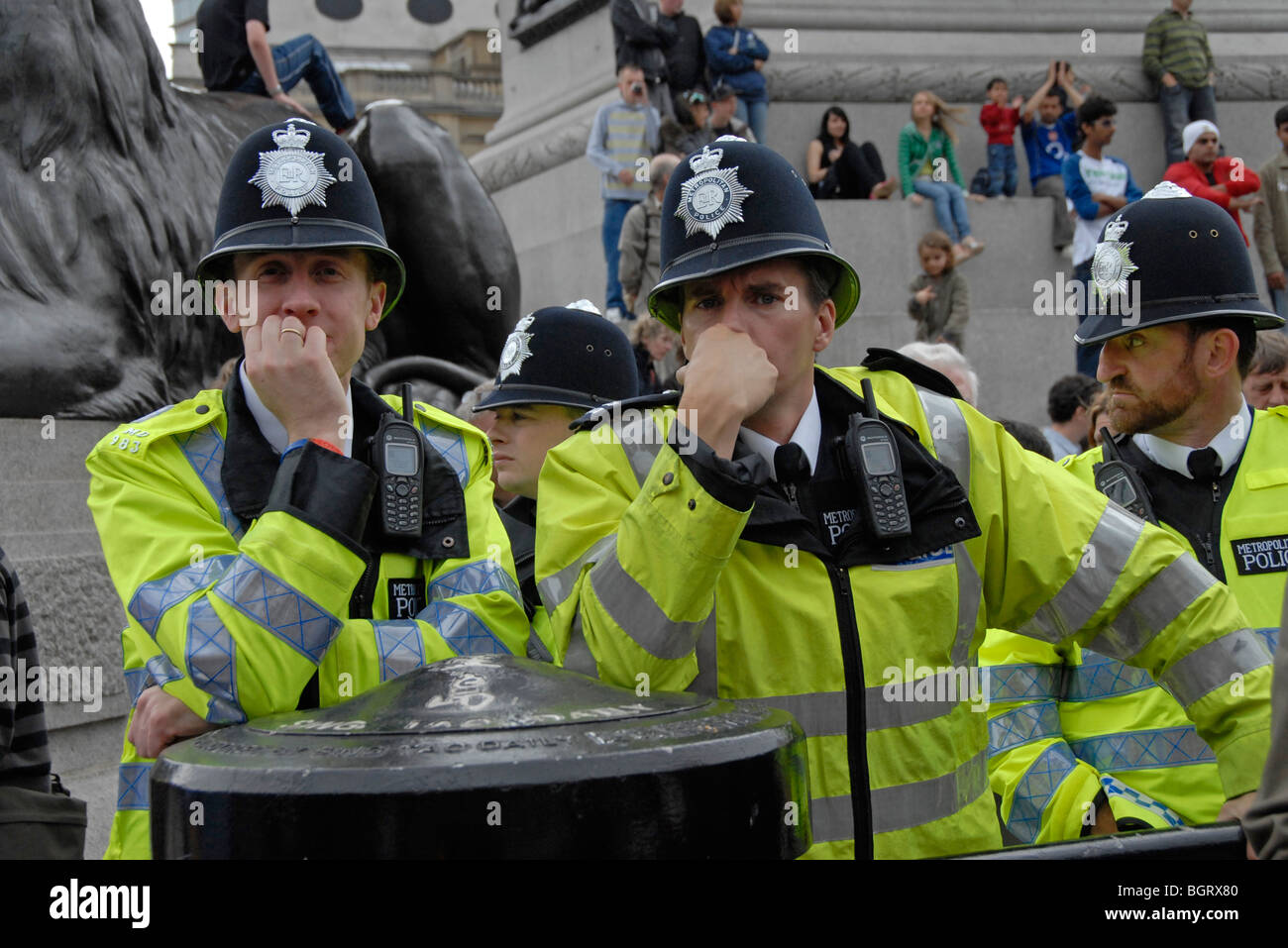 Police watching and looking puzzled and amused Stock Photo - Alamy