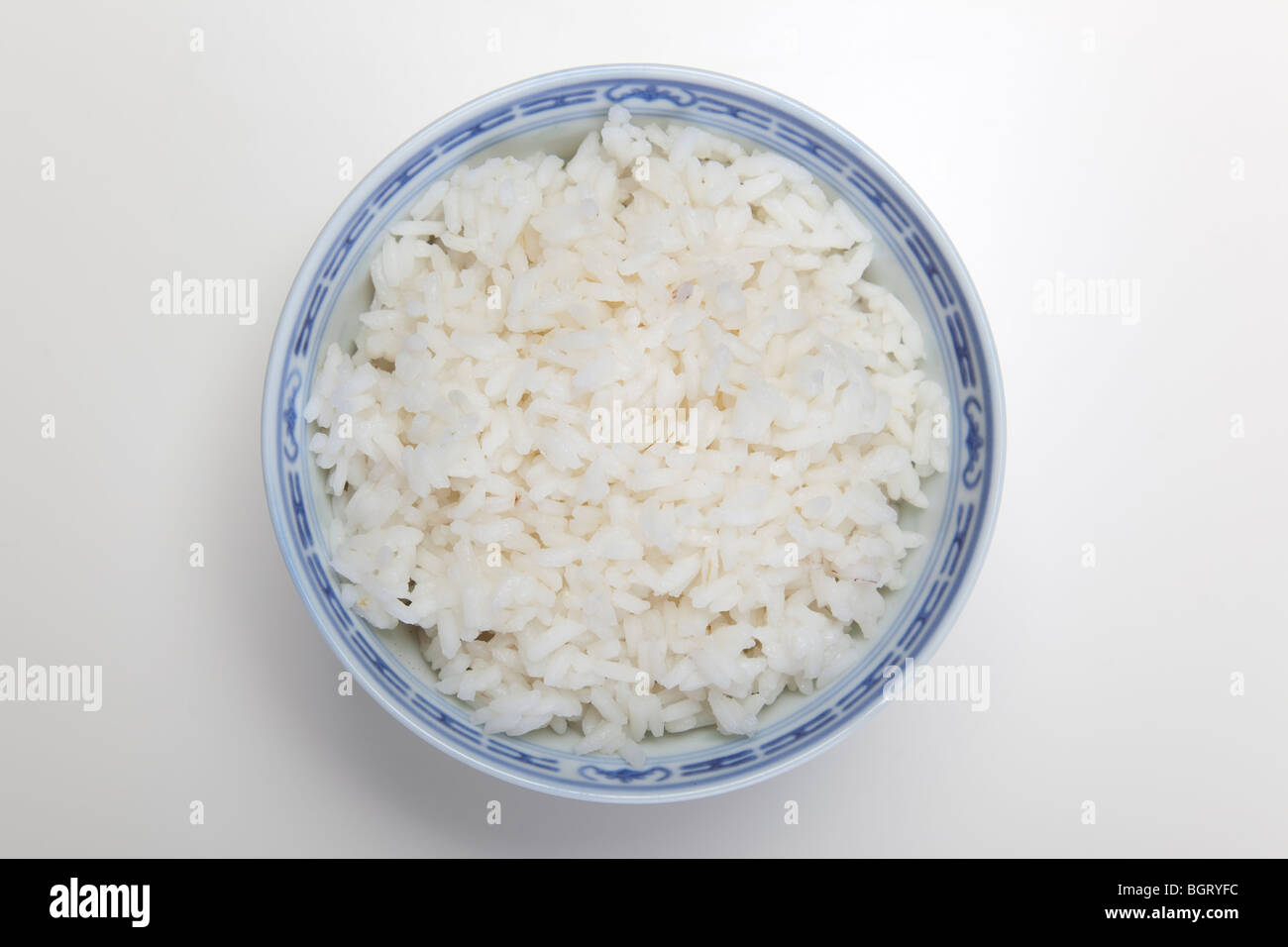 Bowl of white rice isolated on white Stock Photo - Alamy