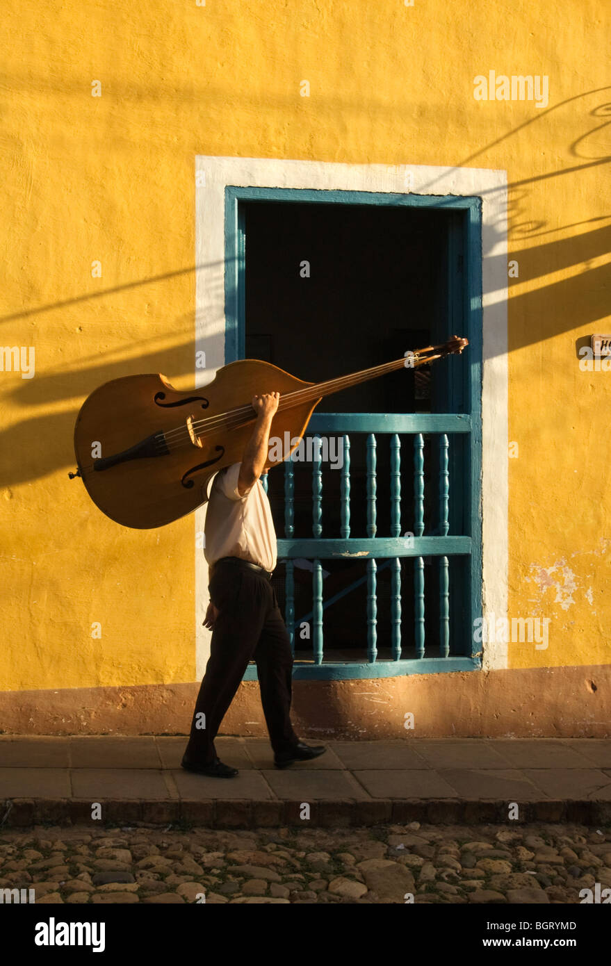 Man carrying double bass musical instrument hi-res stock photography ...