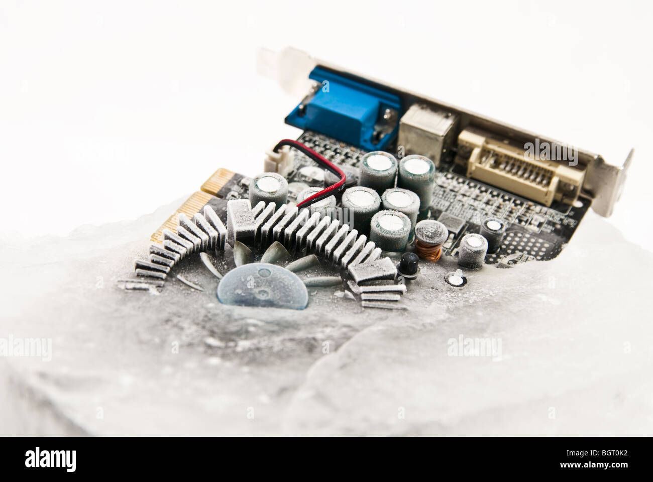 frozen computer part in ice cube on winter time Stock Photo - Alamy