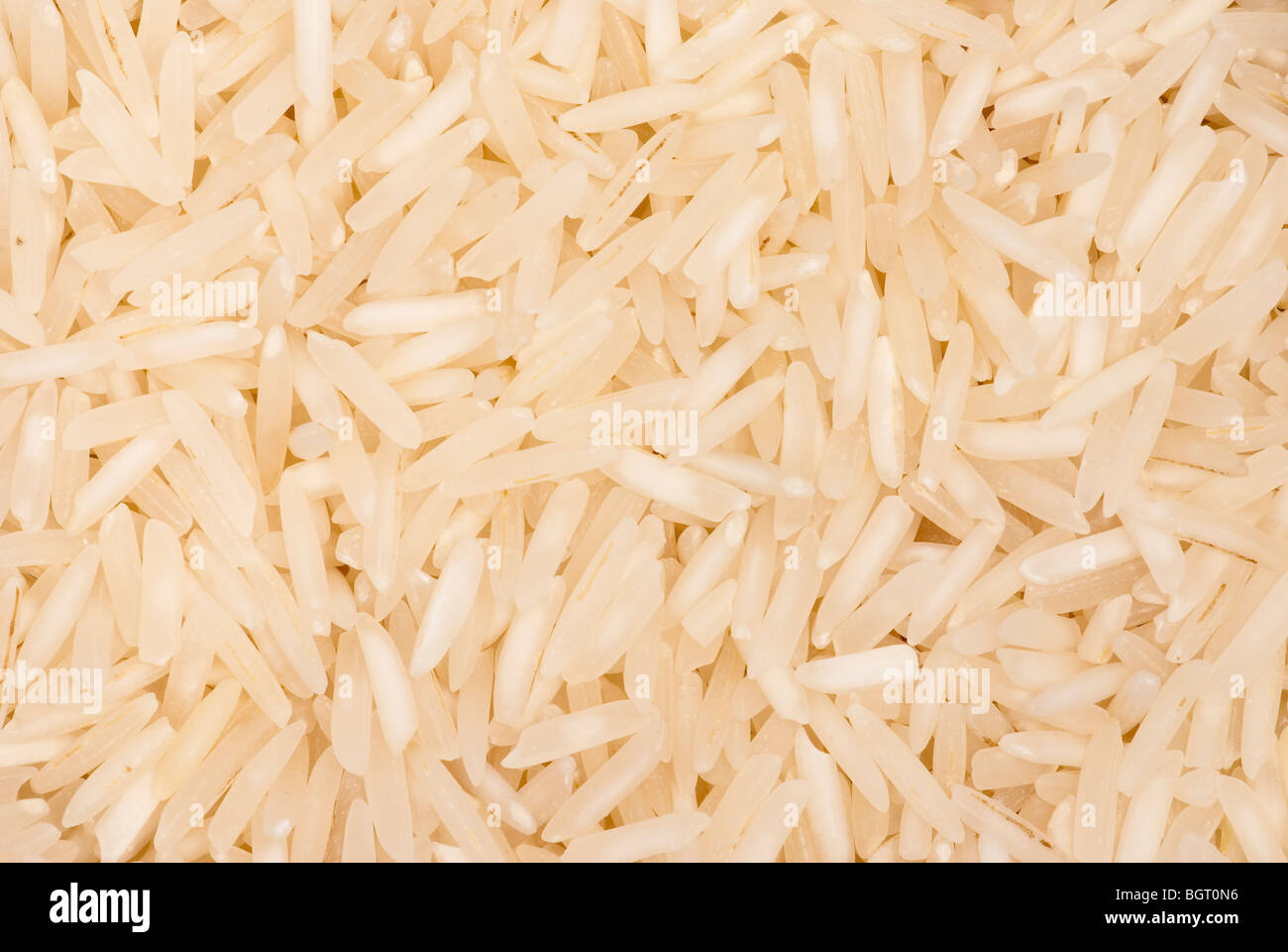 White long grain rice background Stock Photo - Alamy