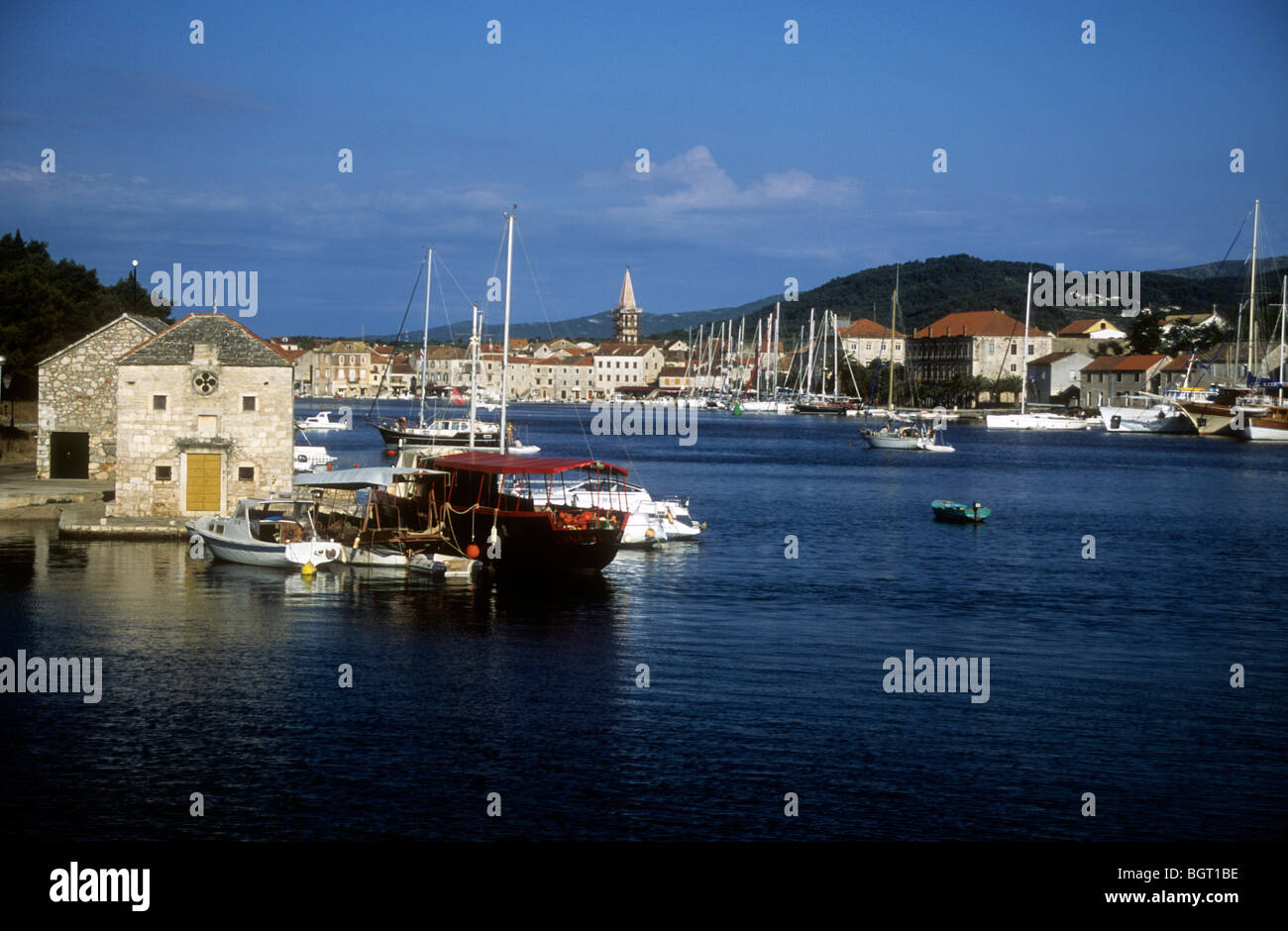 View into Stari Grad harbour with town in background Stock Photo - Alamy