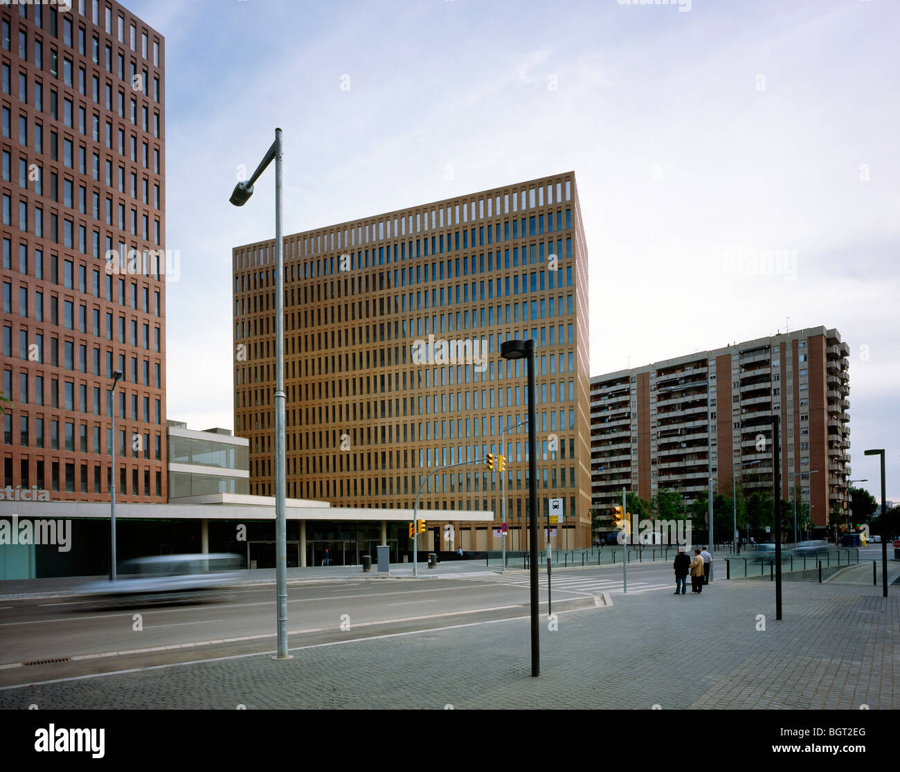 general exterior evening view of rear entrance and access to atrium as ...