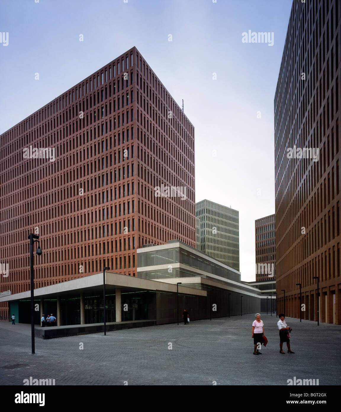 general exterior evening view of rear entrance and access to atrium as ...