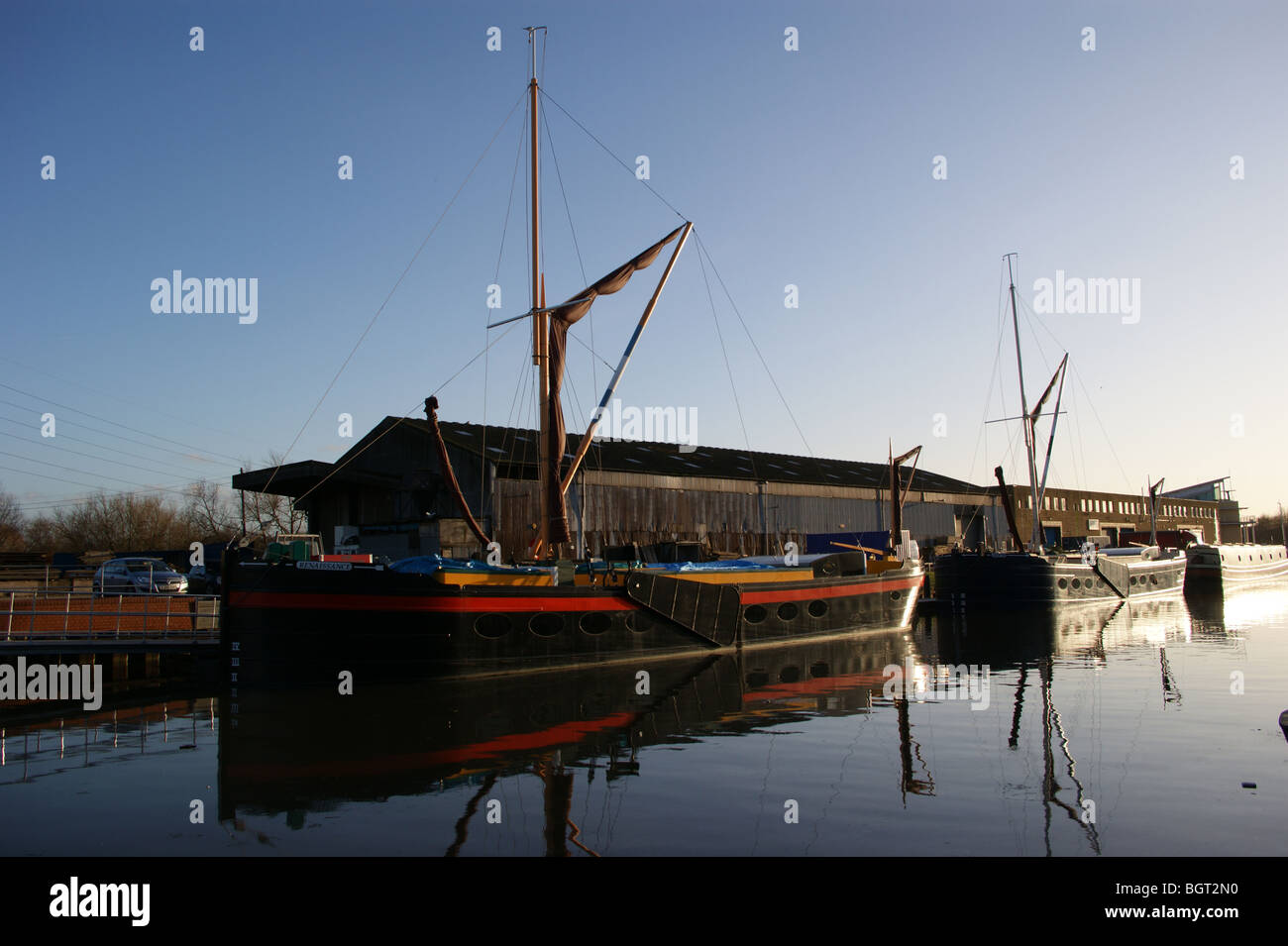 Thames Barges at their winter mooring at sunset on the River Lea ...