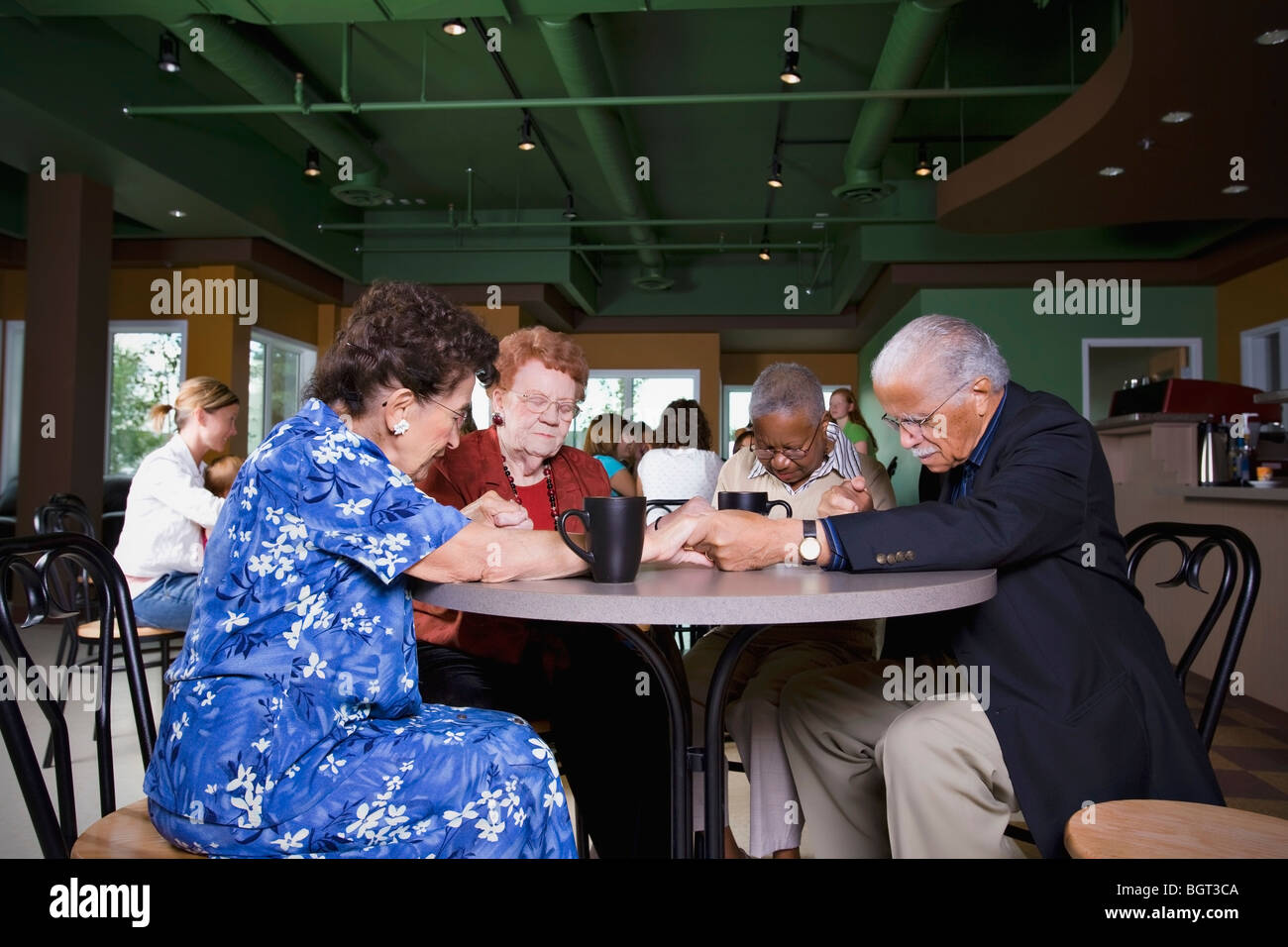 Friends praying together Stock Photo - Alamy
