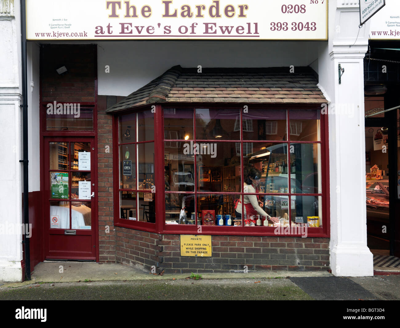 Village Shop Front advertising Biscuits Ashtead Village Surrey Stock ...
