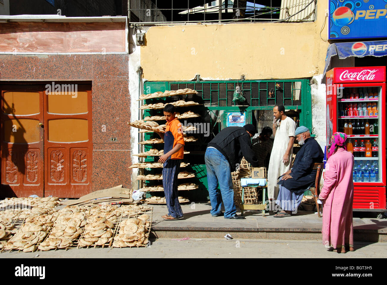 ASWAN, EGYPT. A bakery selling freshly-baked flatbread ('aish shamsi ...